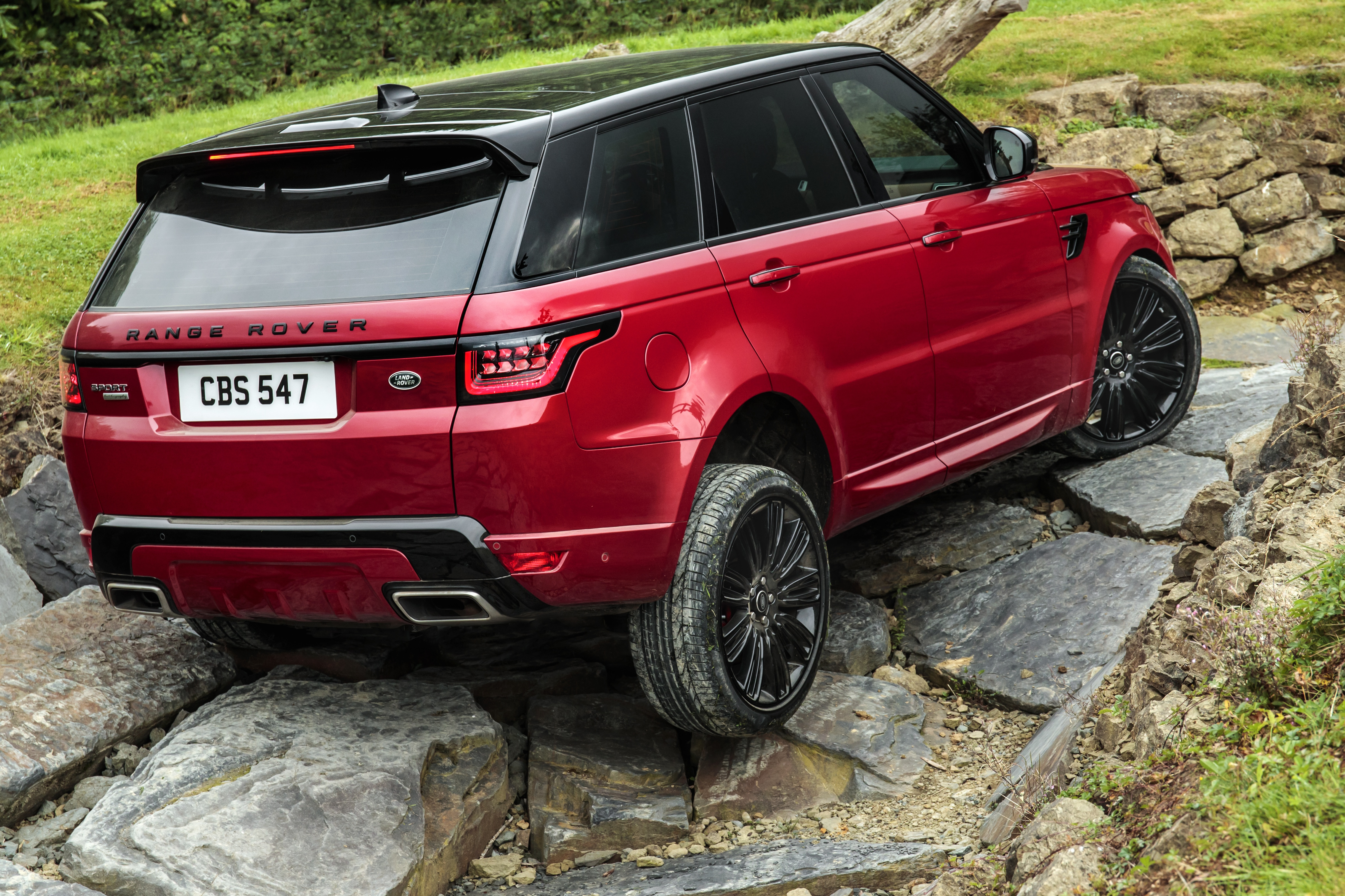 A red Range Rover driving over rocks. · 1920x1080 Full HD free photo ...