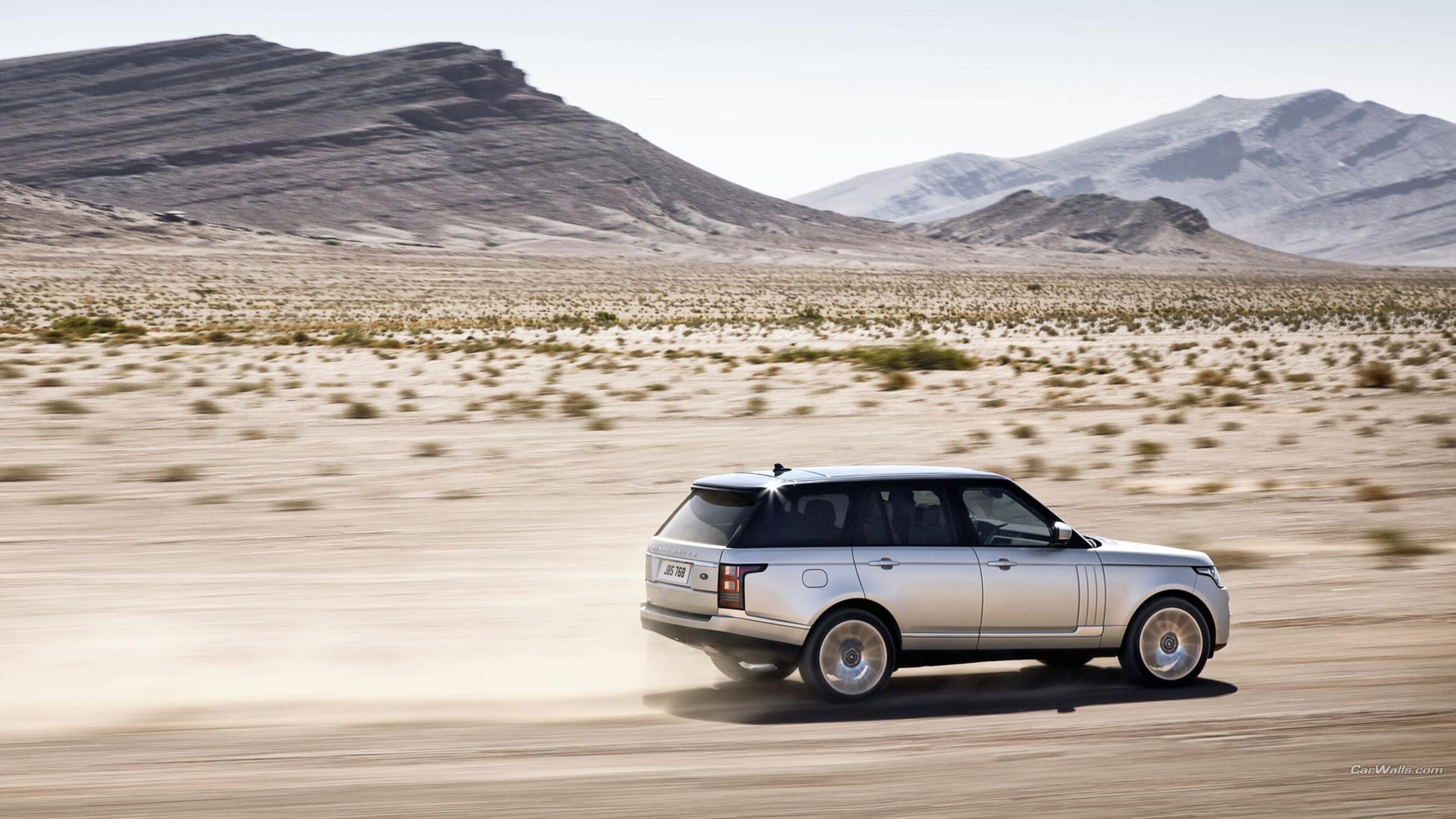 Range Rover едет по пыли на большой скорости · 2560x1440 Qhd And Wqhd 16